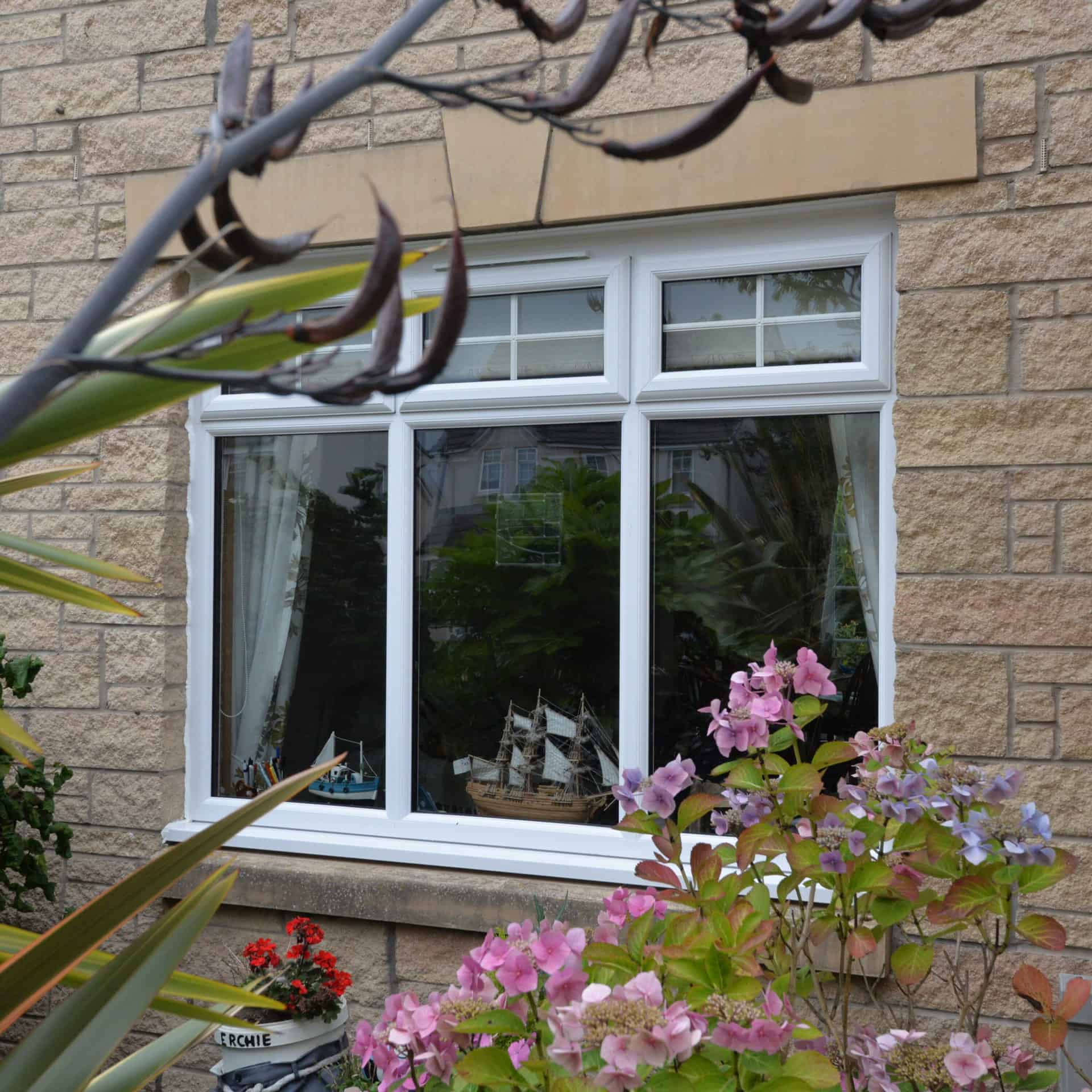 White windows and full oak surrounds completes house - CR Smith