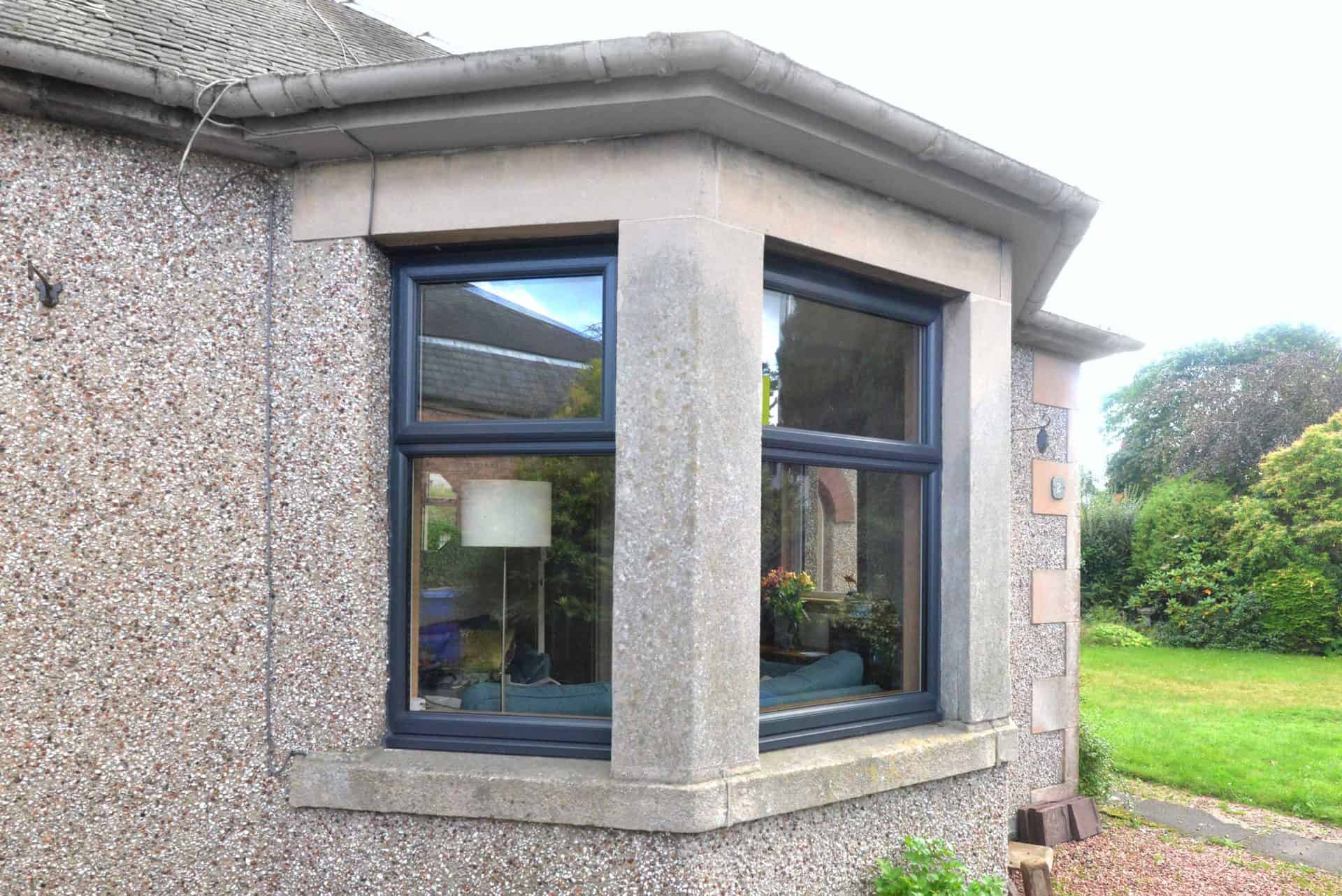 Modern grey windows & doors with oak interior finish - CR Smith